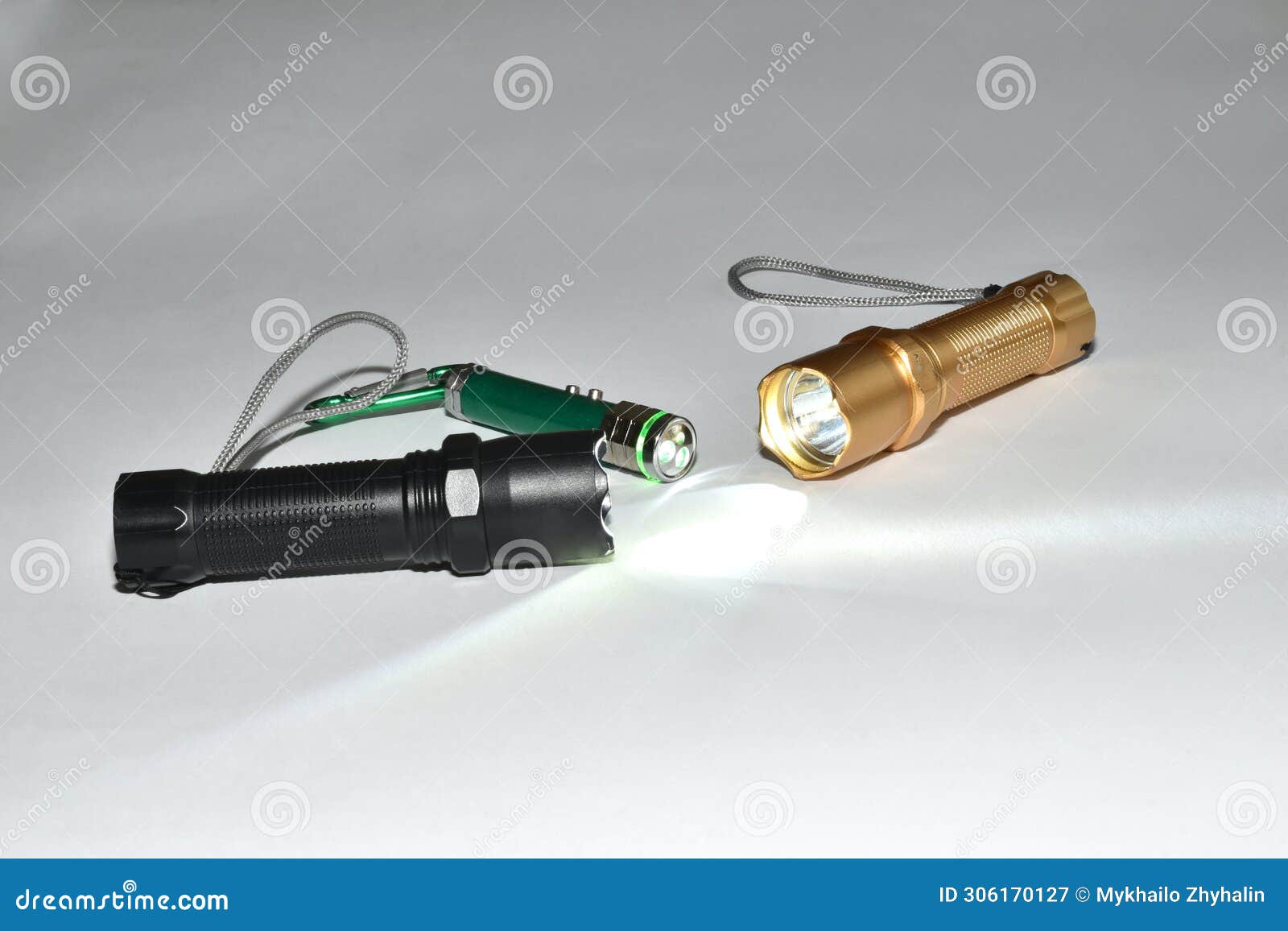 Three Hand-held Flashlights Lie on the Table. Stock Image - Image of ...