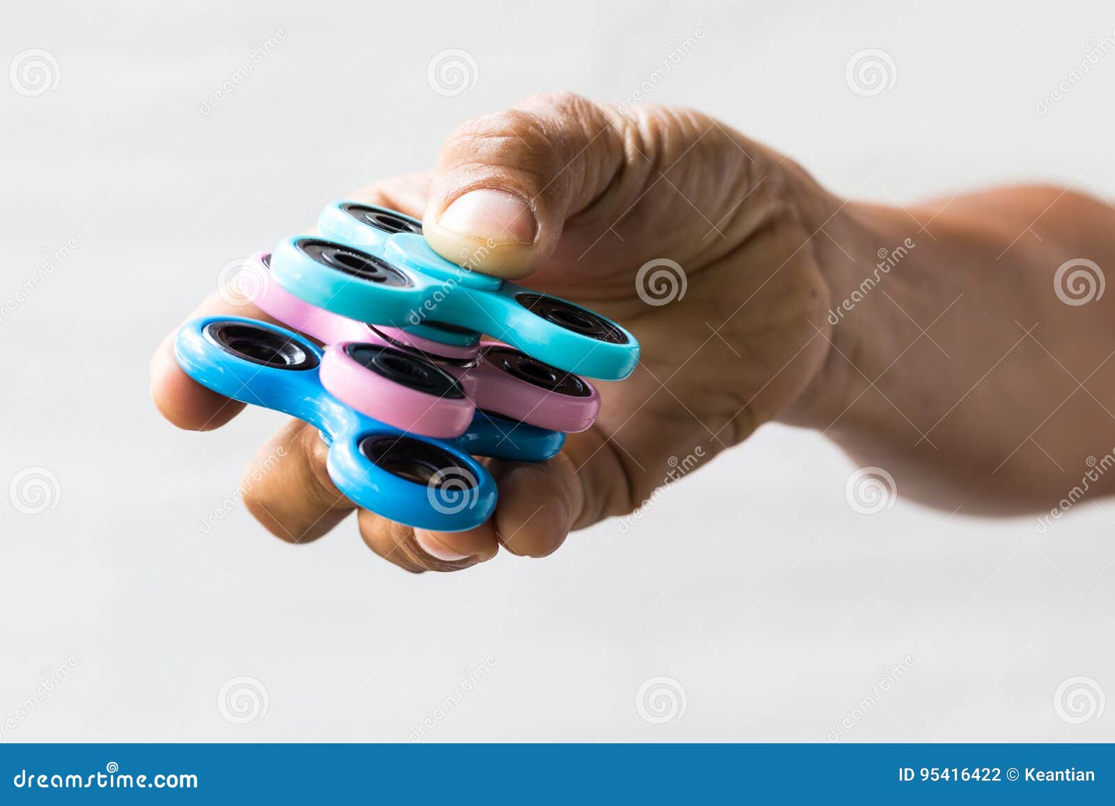 Three Hand Spinners in the Fingers. Stock Photo - Image of hand ...