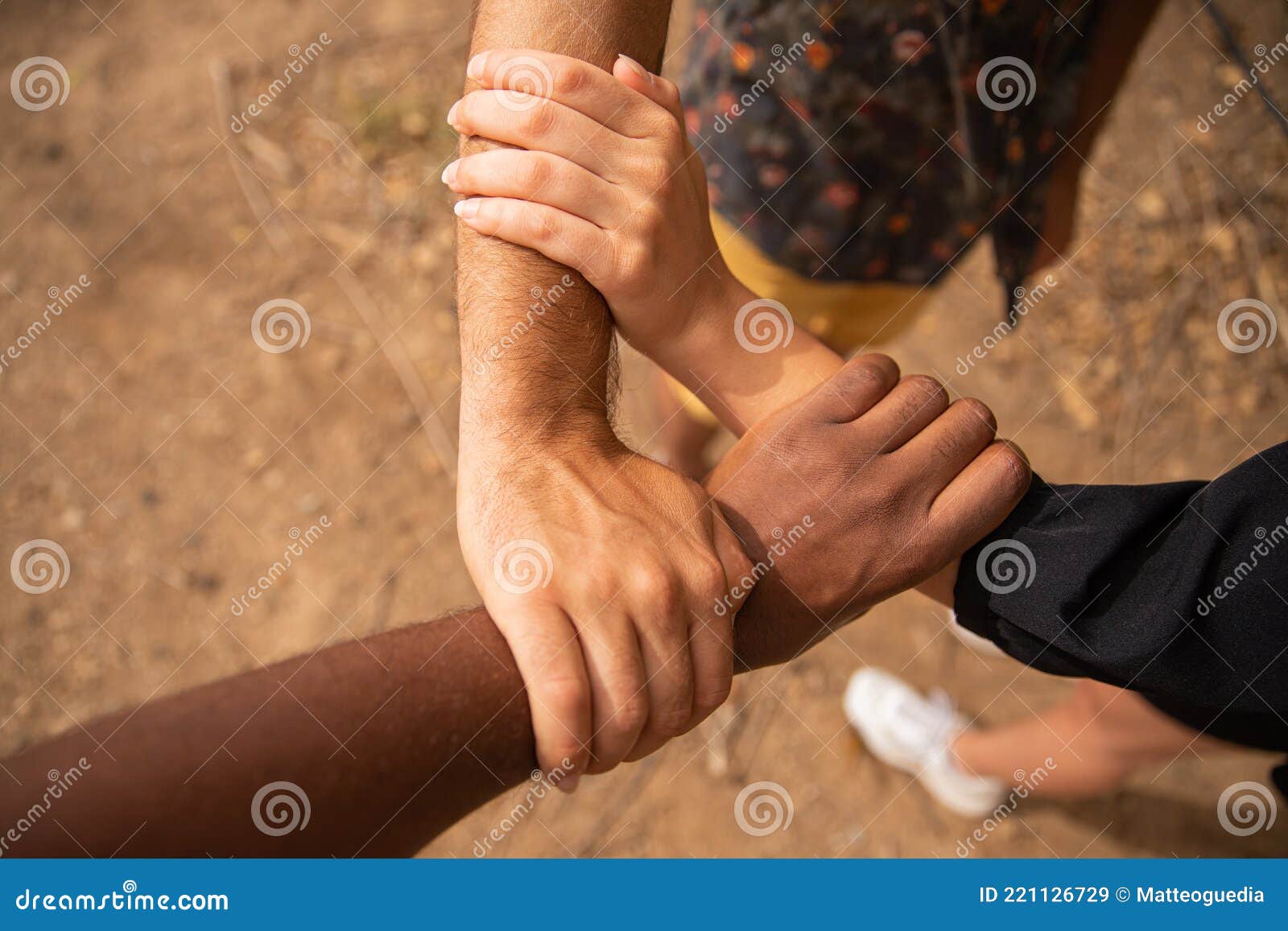 Three Hands of Different Ethnicities Grasp Each Other and Form a ...