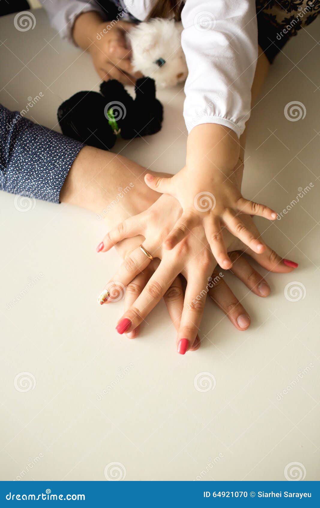 Three Hands on the Table - Baby, Mother and Father. Stock Photo - Image ...