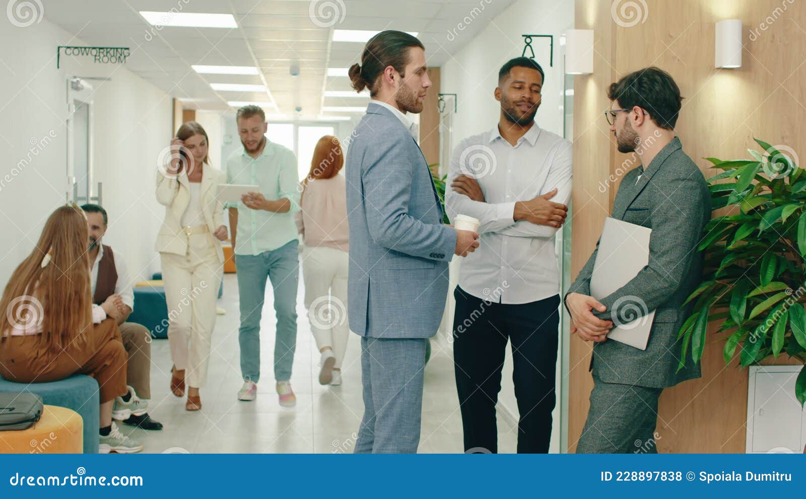 Three Handsome Workers are Having a Conversation about Work in the ...