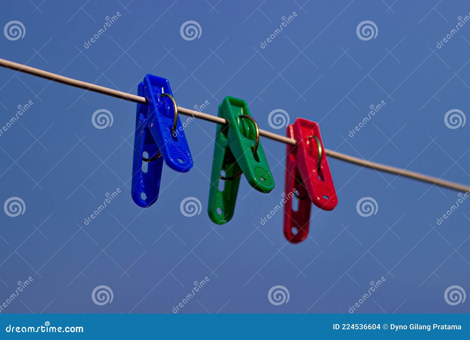 Three hangers on a rope stock photo. Image of line, machine - 224536604