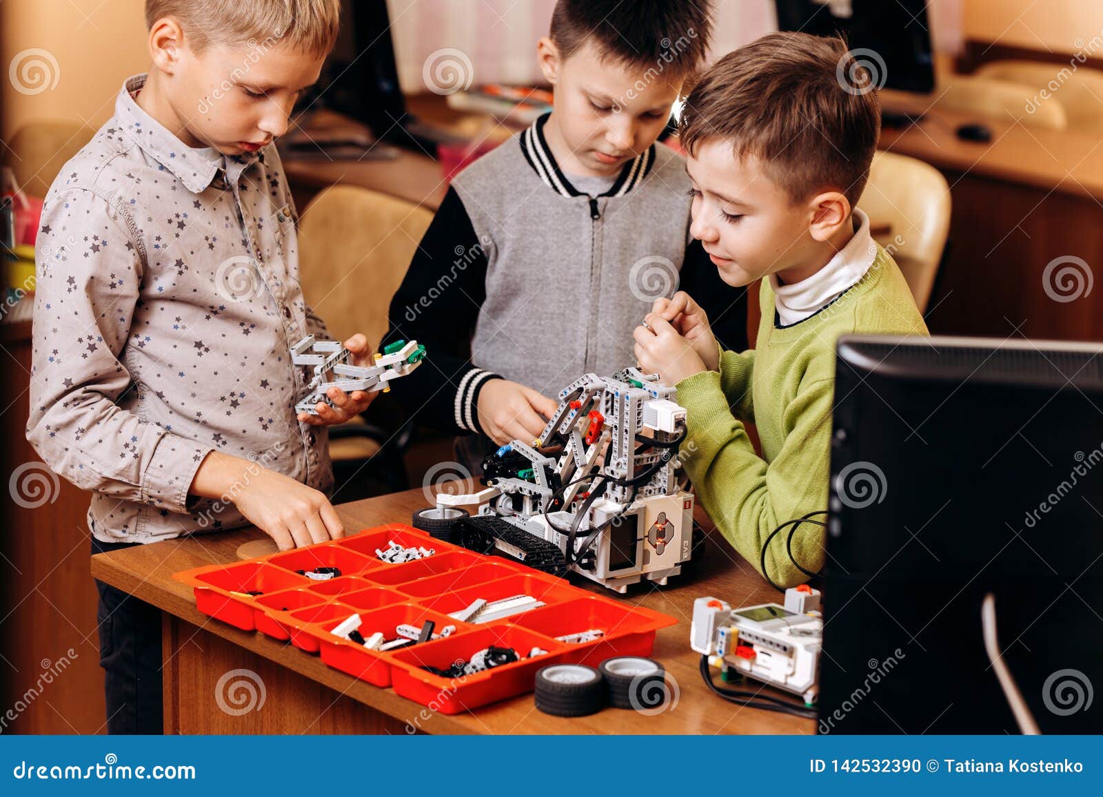 Three Happy Boys are Making Robots in the School of Robotics Stock ...