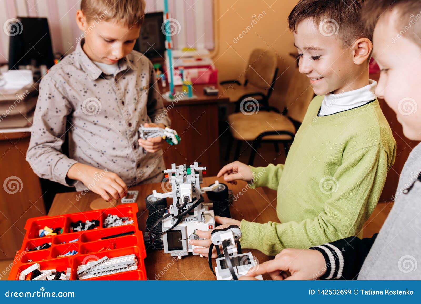 Three Happy Boys are Making Robots in the School of Robotics Stock ...