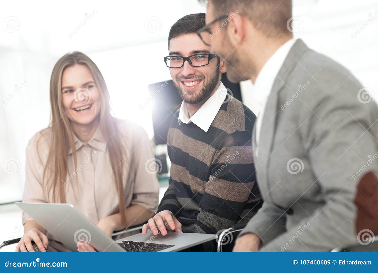 Three Happy Employees Working on Line with a Tablet Stock Image - Image ...