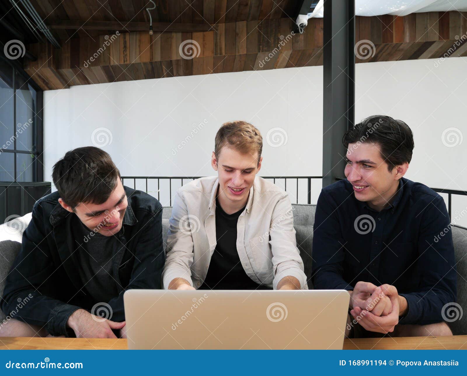Three Happy Freelance Men Working Together in Coworking Space Stock ...