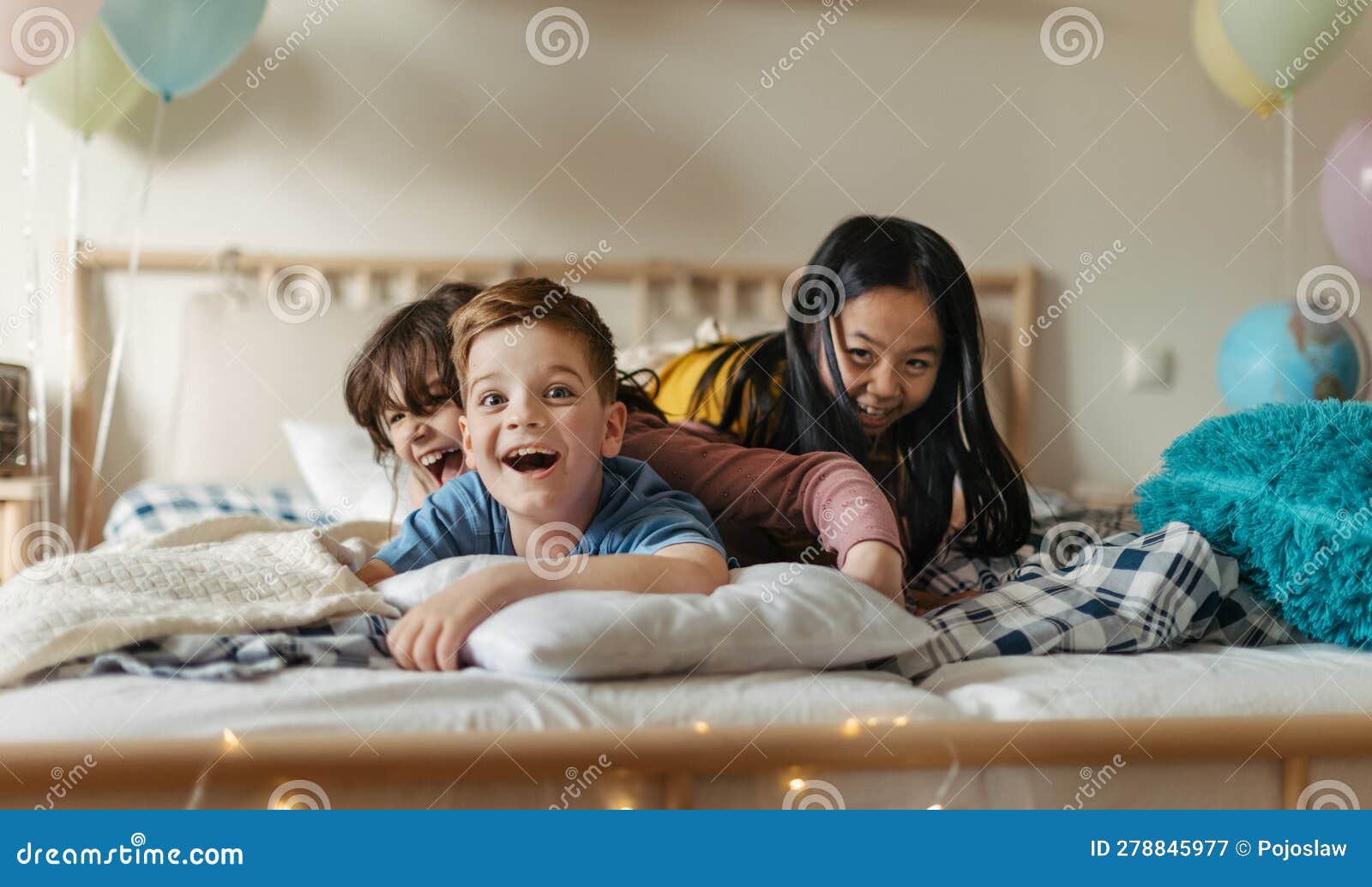 Three Happy Friends Having Fun Together in a Room. Stock Image - Image ...