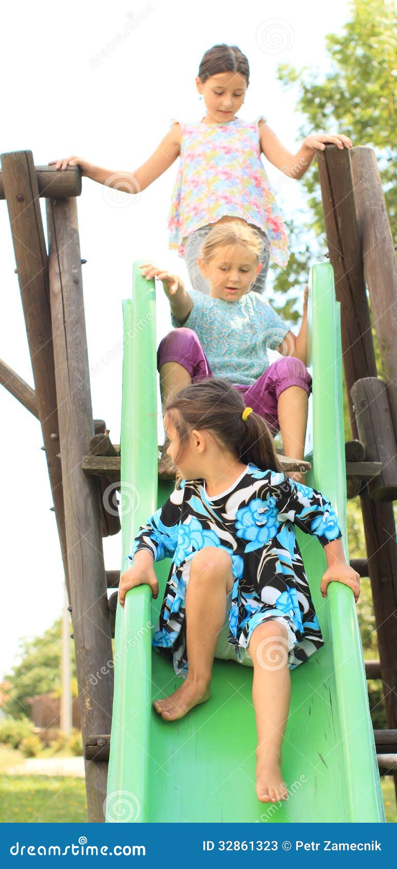 Three Happy Girls on a Slide Stock Image - Image of happiness, portrait ...