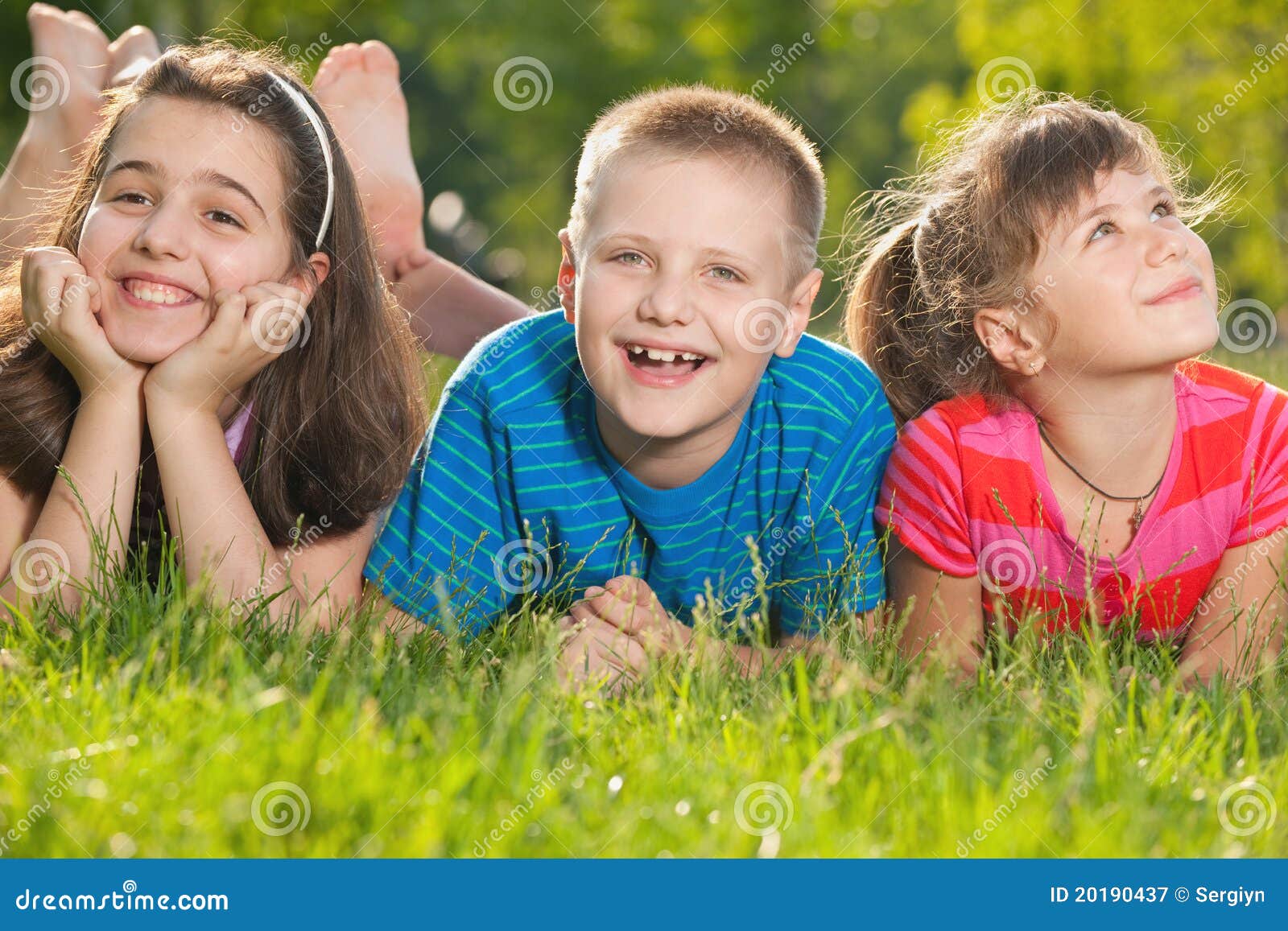 Three Happy Kids On The Grass Royalty-Free Stock Photography ...