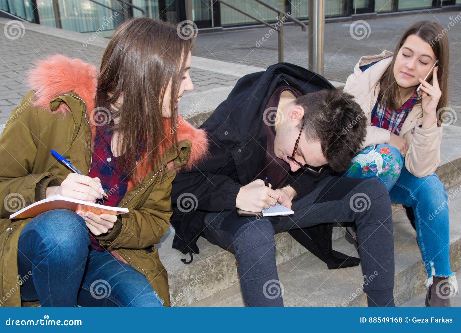 Three Happy Smiling Students are Learning Stock Photo - Image of cell ...