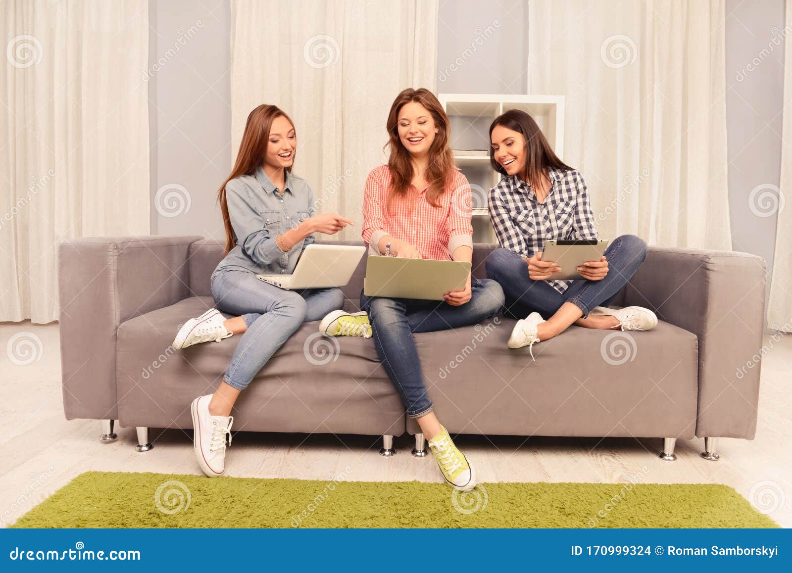 Three Happy Women with Digital Devices Chatting in Internet Stock Photo ...