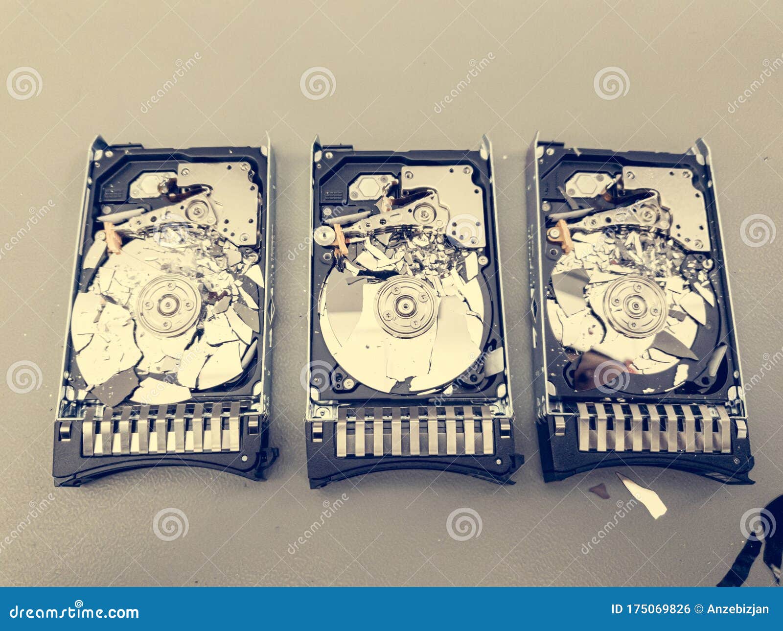 Three Hard Disk Drives with Shattered Platter on a Table. Stock Photo ...