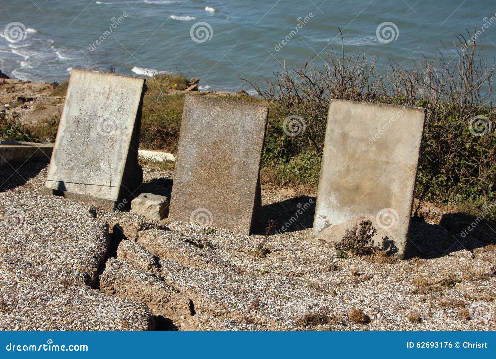Three Headstone at Edge of Cliff with Ocean Background Stock Photo ...