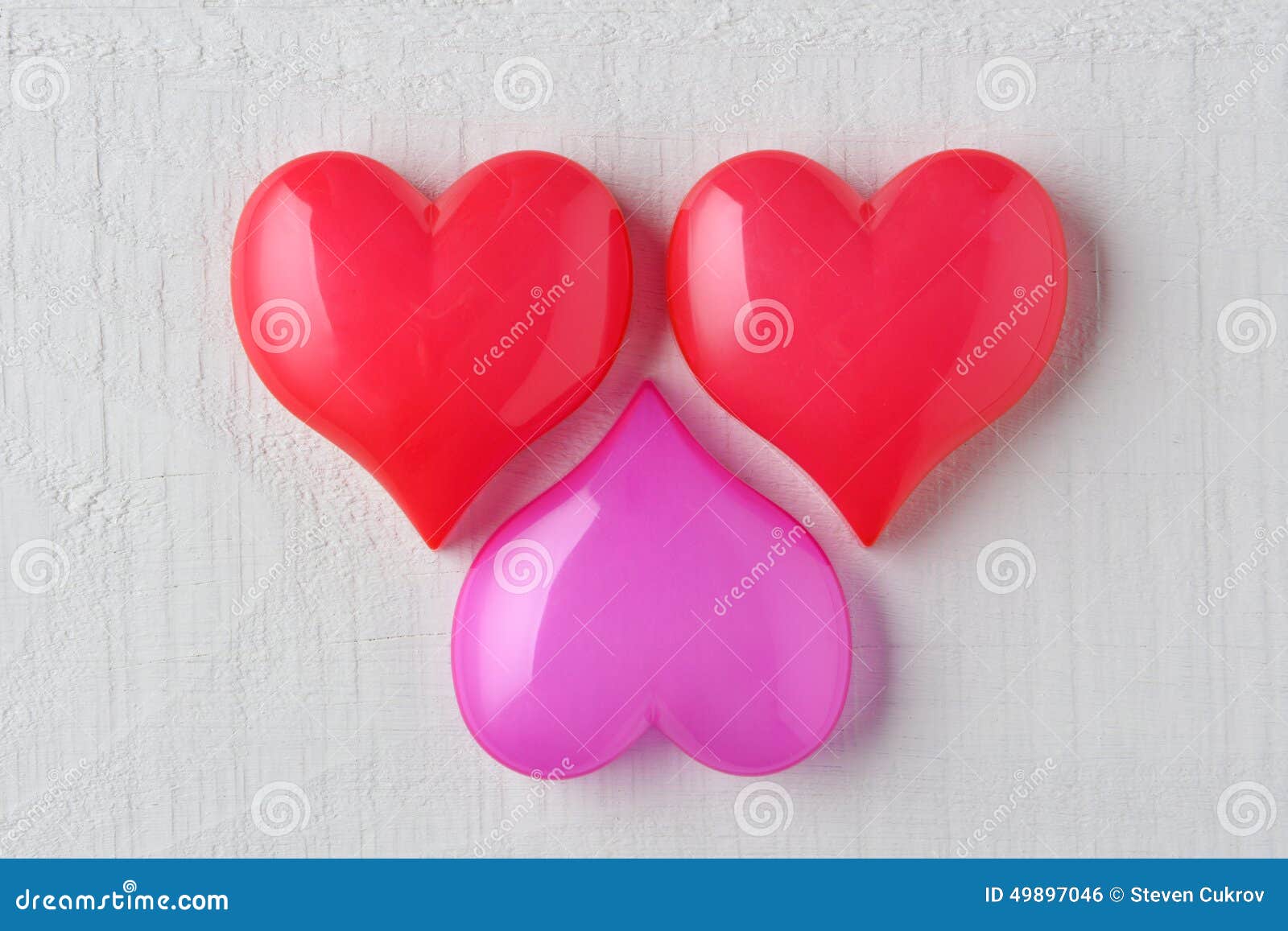 Three Hearts on Wood Table stock photo. Image of table - 49897046