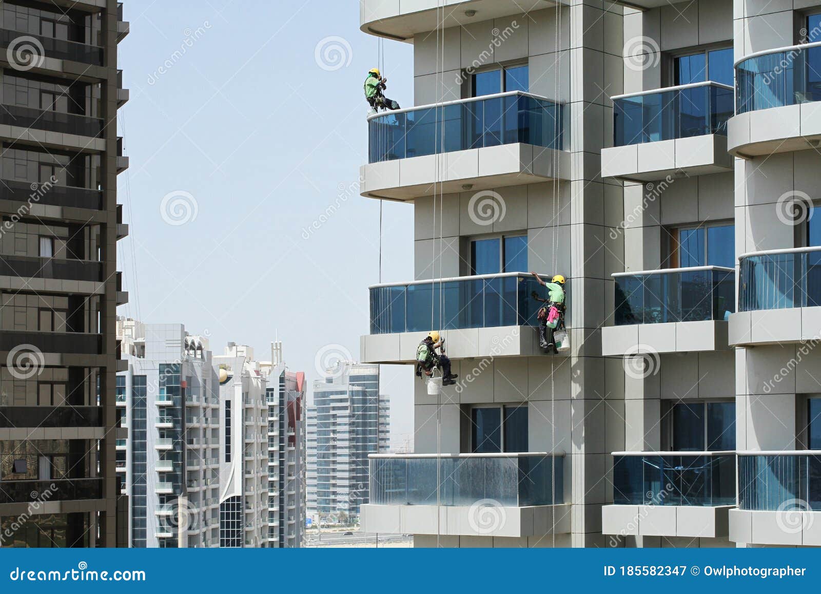 Three High-rise Workers Wash Windows of a High-rise Building Stock ...