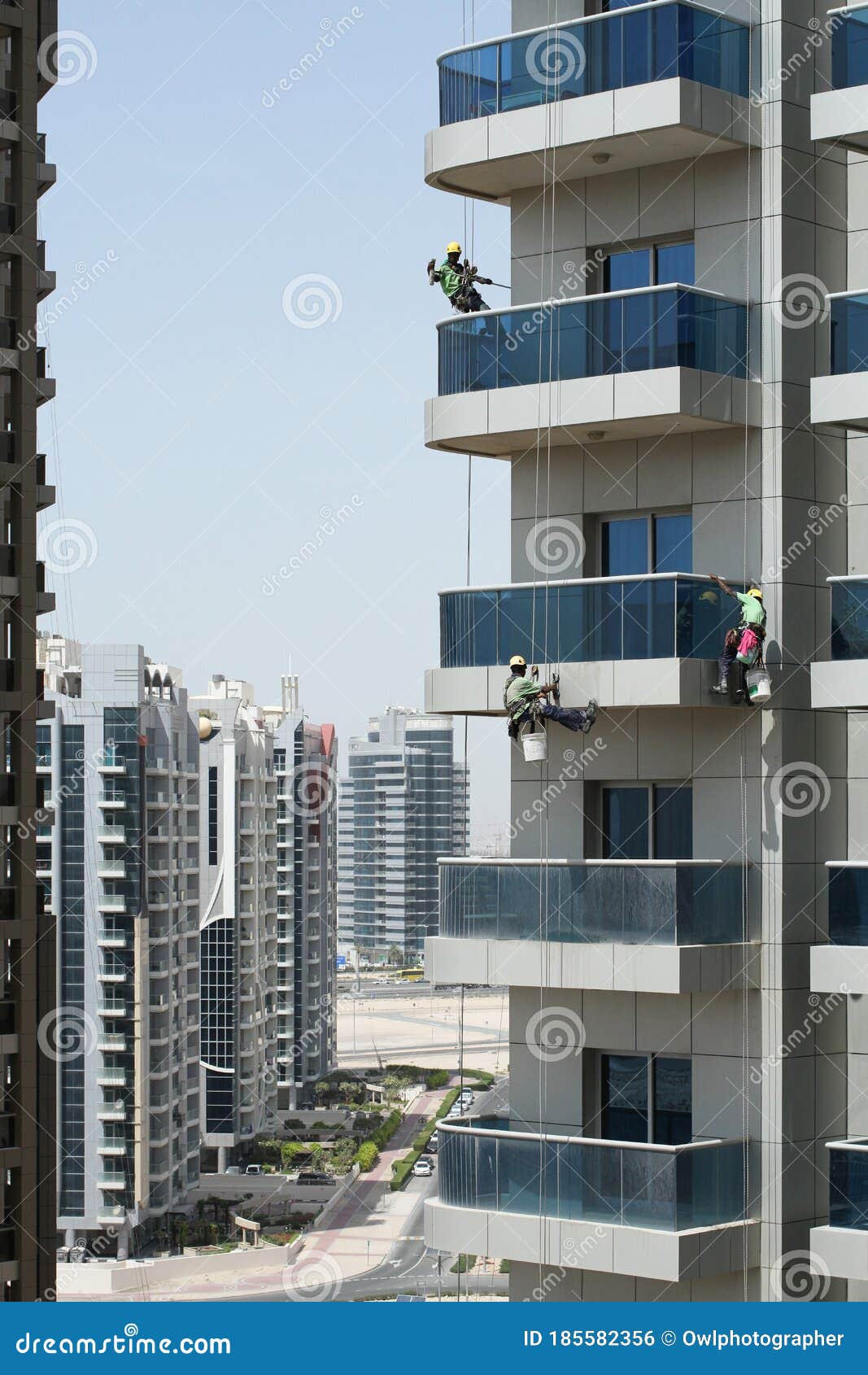 Three High-rise Workers Wash Windows of a High-rise Building Stock ...