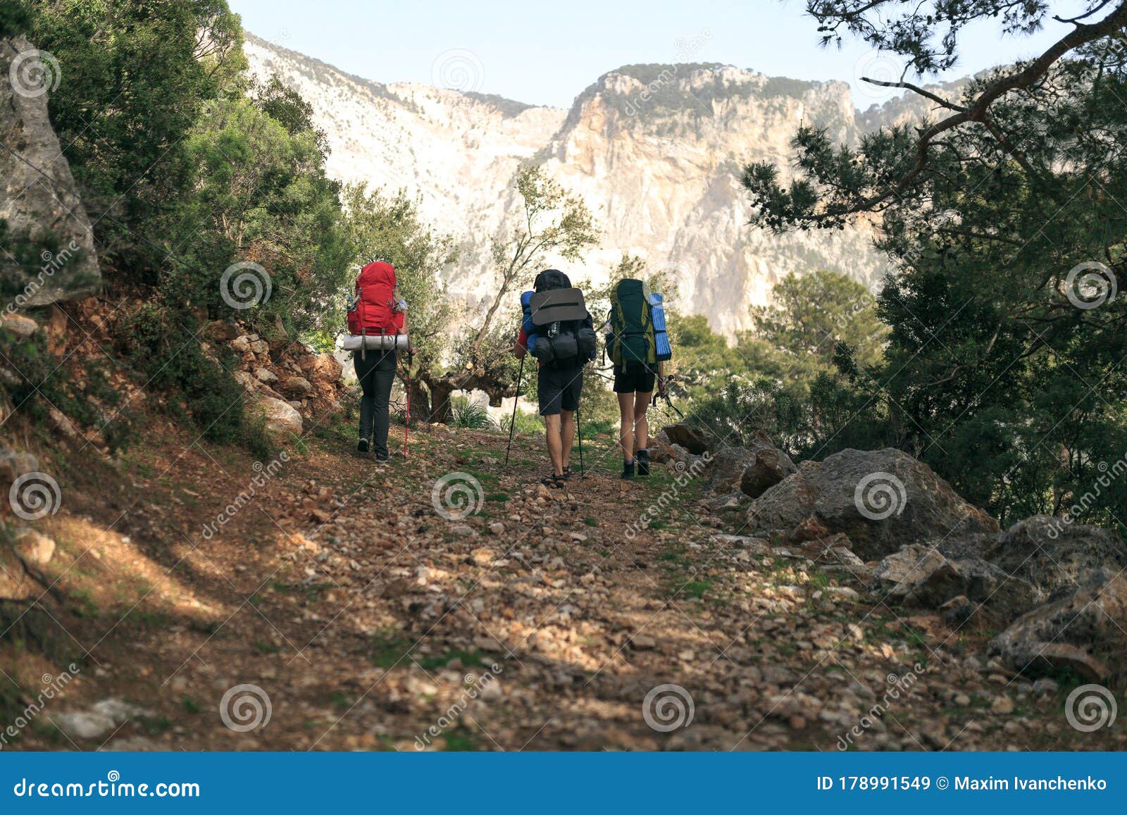 Three Hikers on Trail in Mountains Stock Image - Image of mountains ...