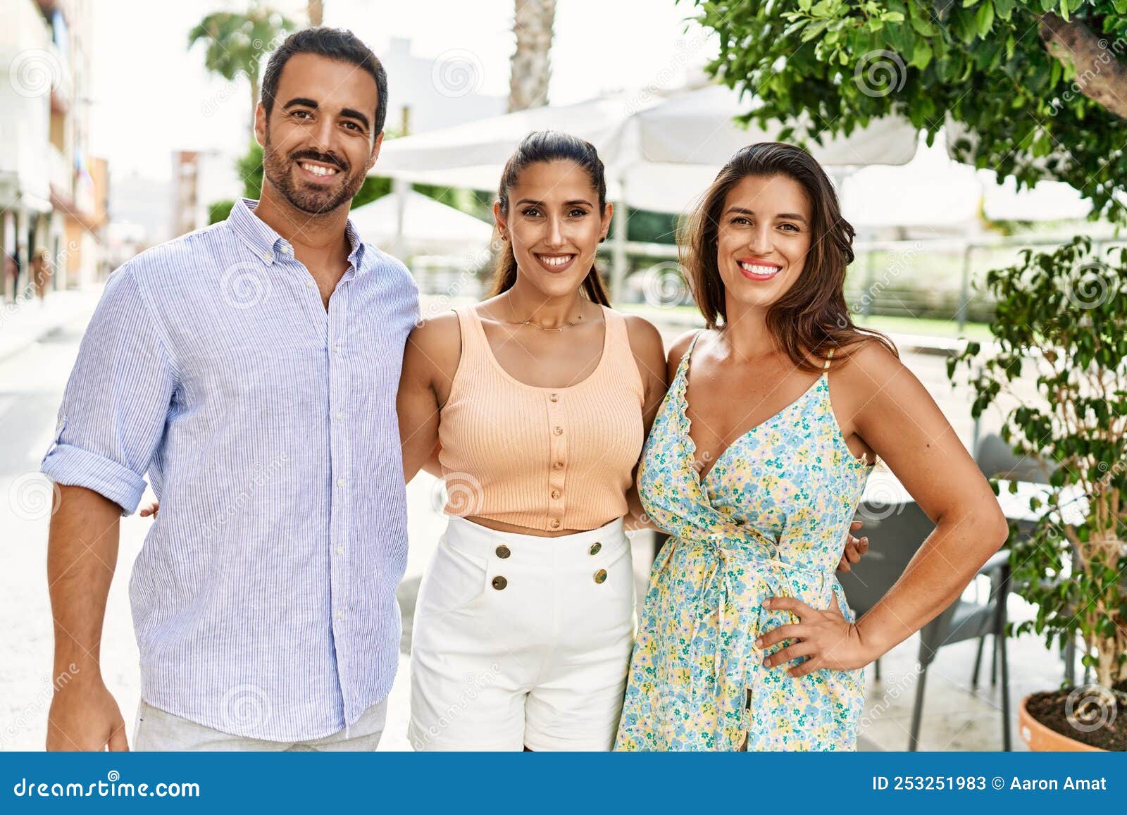 Three Hispanic Friends Smiling Happy and Hugging at the City Stock ...