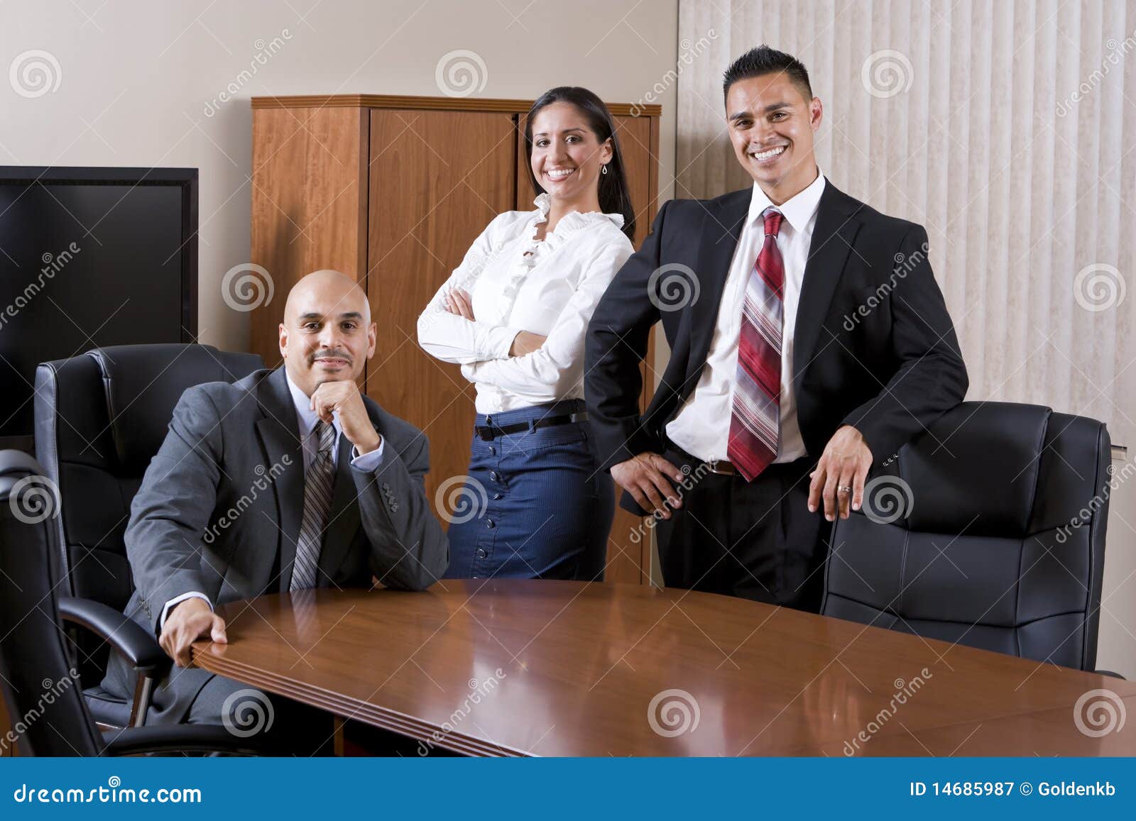 Three Hispanic Office Workers in Boardroom Stock Image - Image of ...