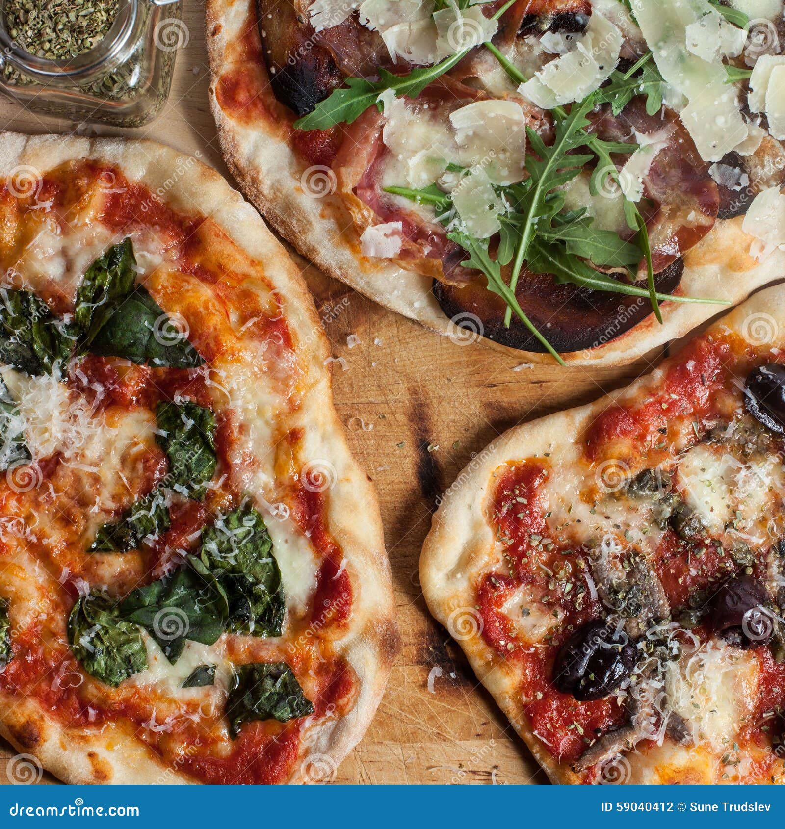 Three homemade pizzas stock photo. Image of neopolitan - 59040412