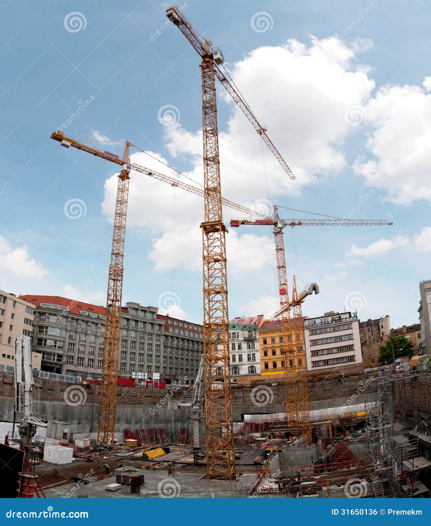 Three Huge Cranes on Construction Site in the Centre of a City Stock ...