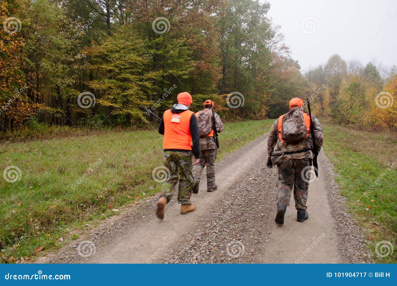 Three hunters in the woods editorial photography. Image of hobby ...