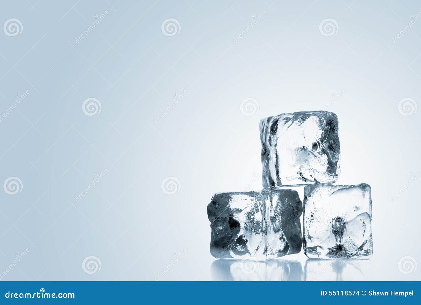 Three Ice Cubes Stacked Over Blue Gradient Background Stock Photo ...