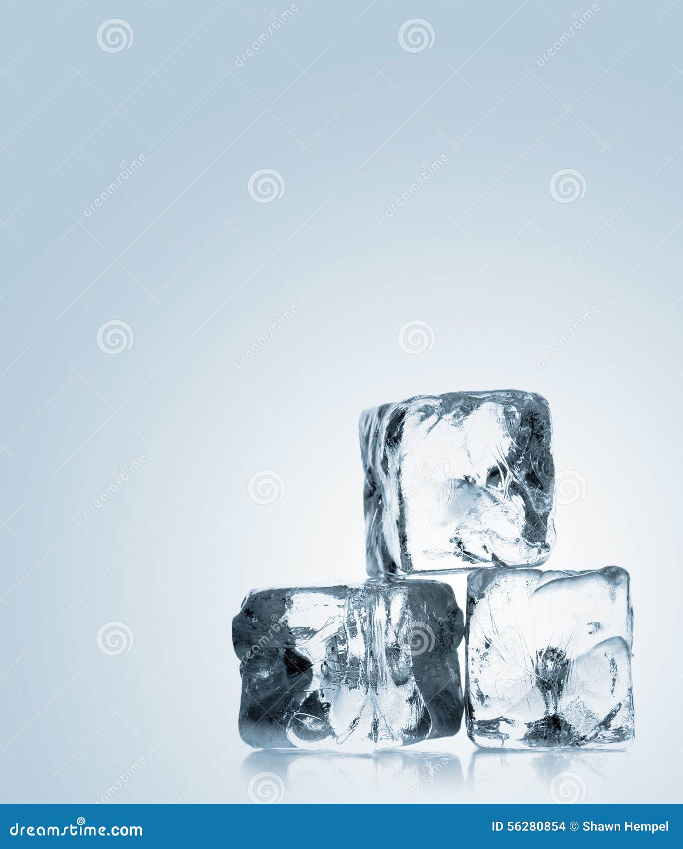 Three Ice Cubes Stacked Over Blue Gradient Background Stock Photo ...