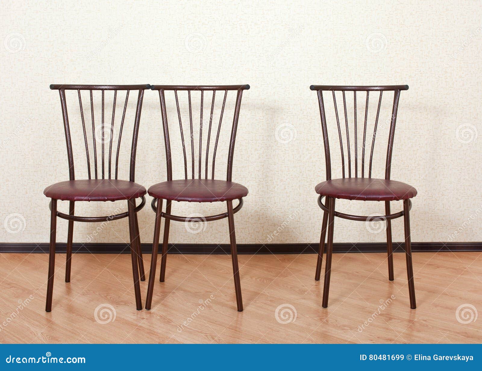 Three Identical Chair Next Against the Wall Stock Image - Image of ...