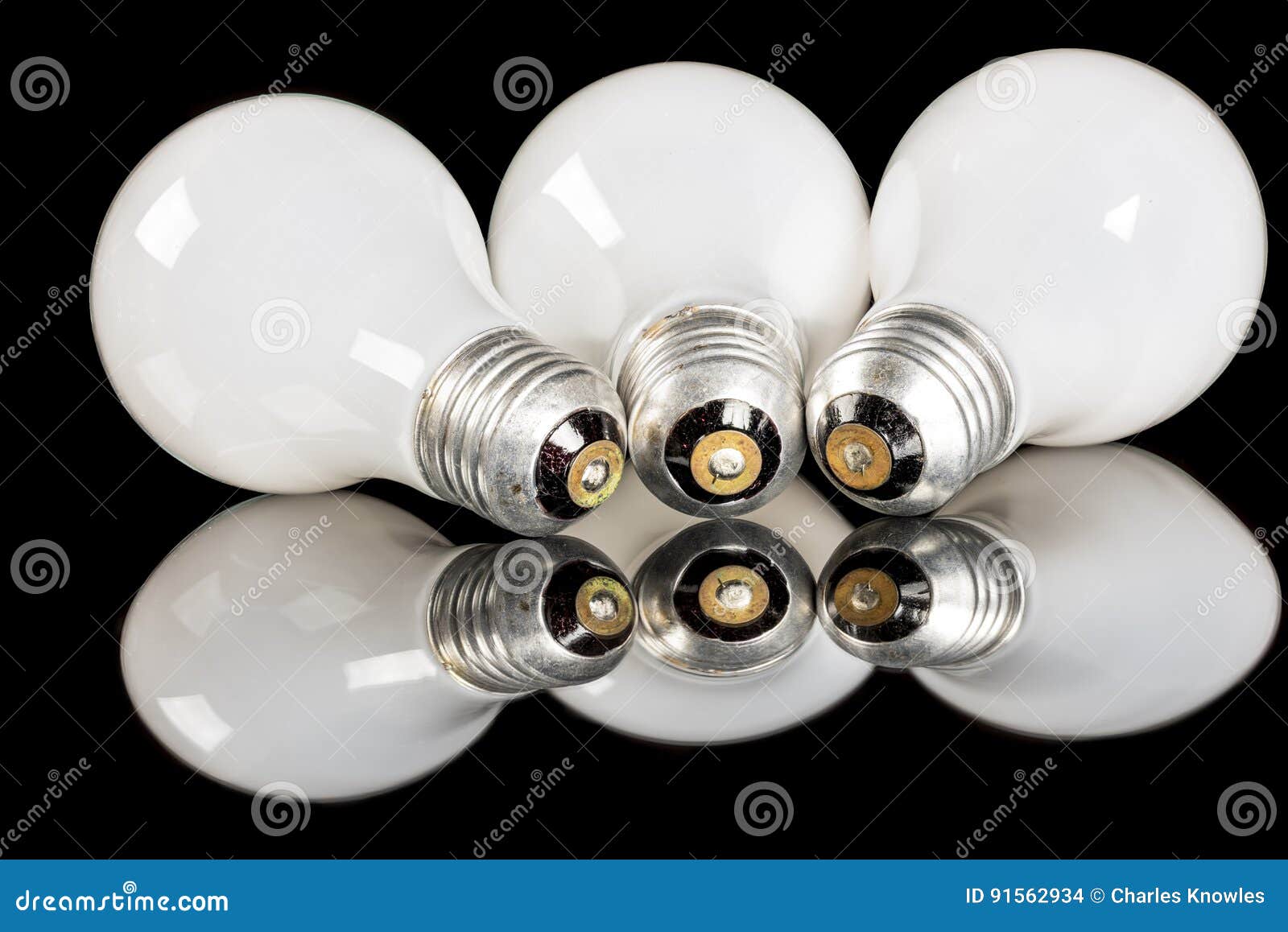 Three Incandescent Light Bulbs in a Row Stock Photo - Image of ...