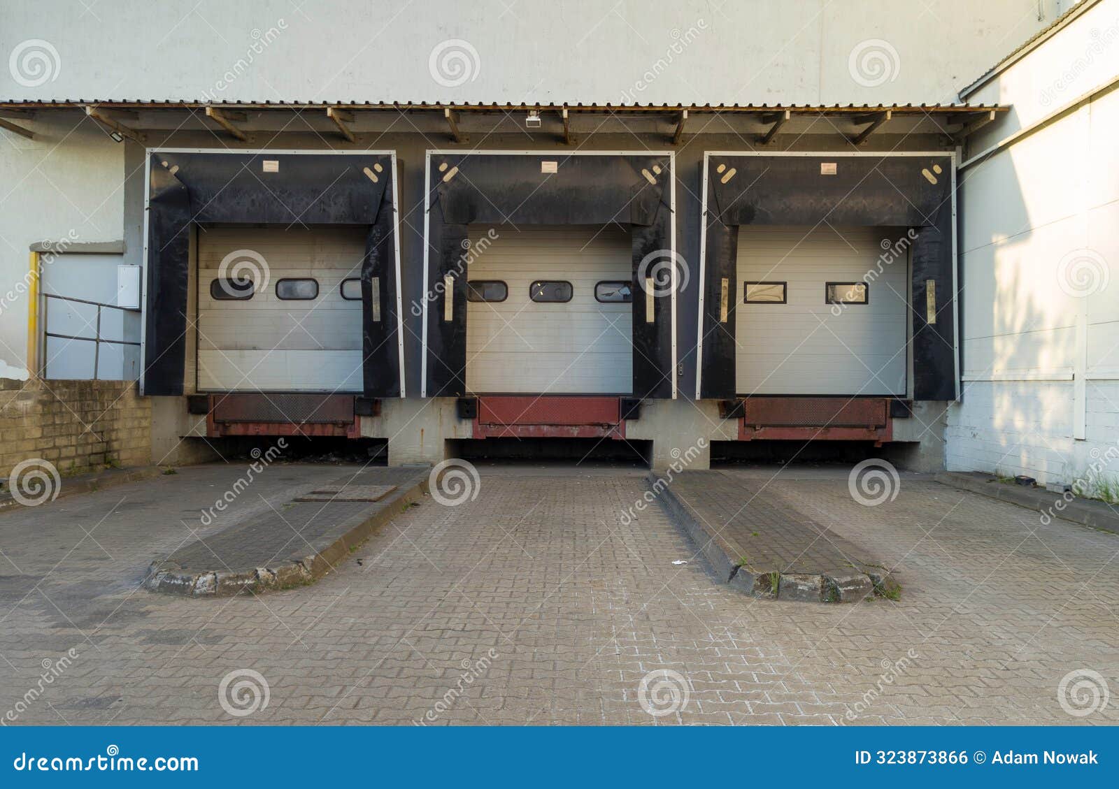 Three Industrial Loading Dock Doors Stock Photo - Image of distribution ...