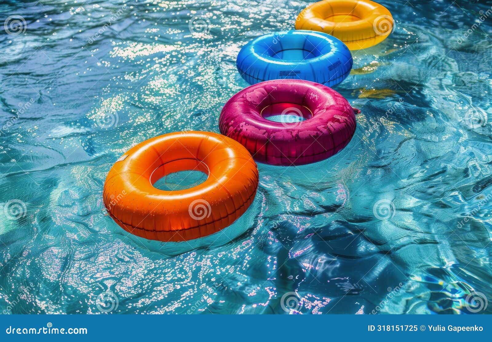 Three Inflatable Floats Drifting in Pool Water Stock Image - Image of ...