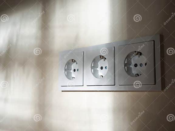 Three Installed Wall Sockets on Light Wall Stock Photo - Image of ...