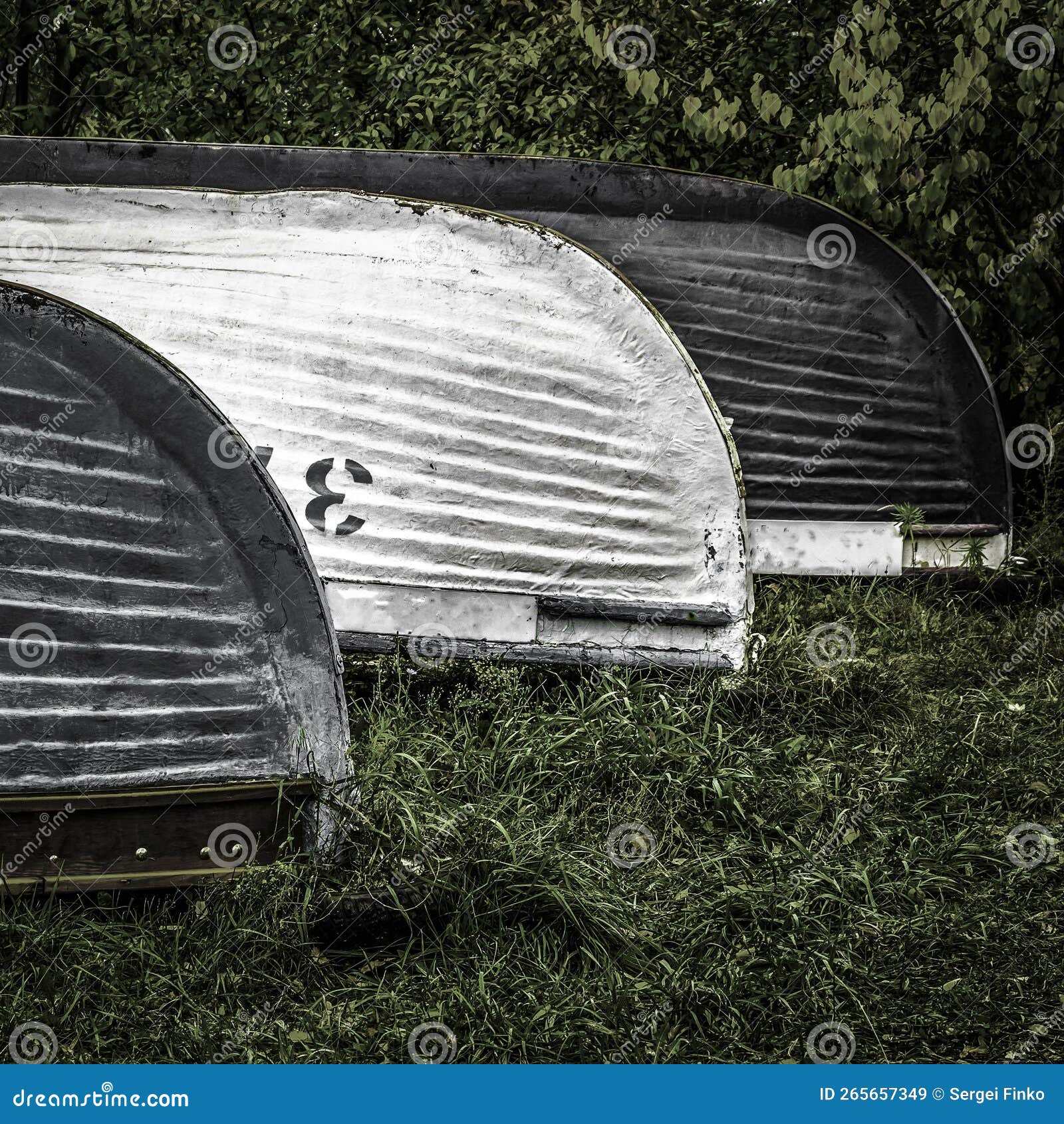 Three inverted boats stock image. Image of nautical - 265657349
