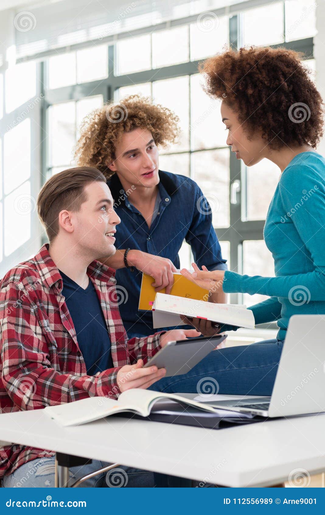 Three Involved Students Sharing Ideas and Opinions about Differe Stock ...