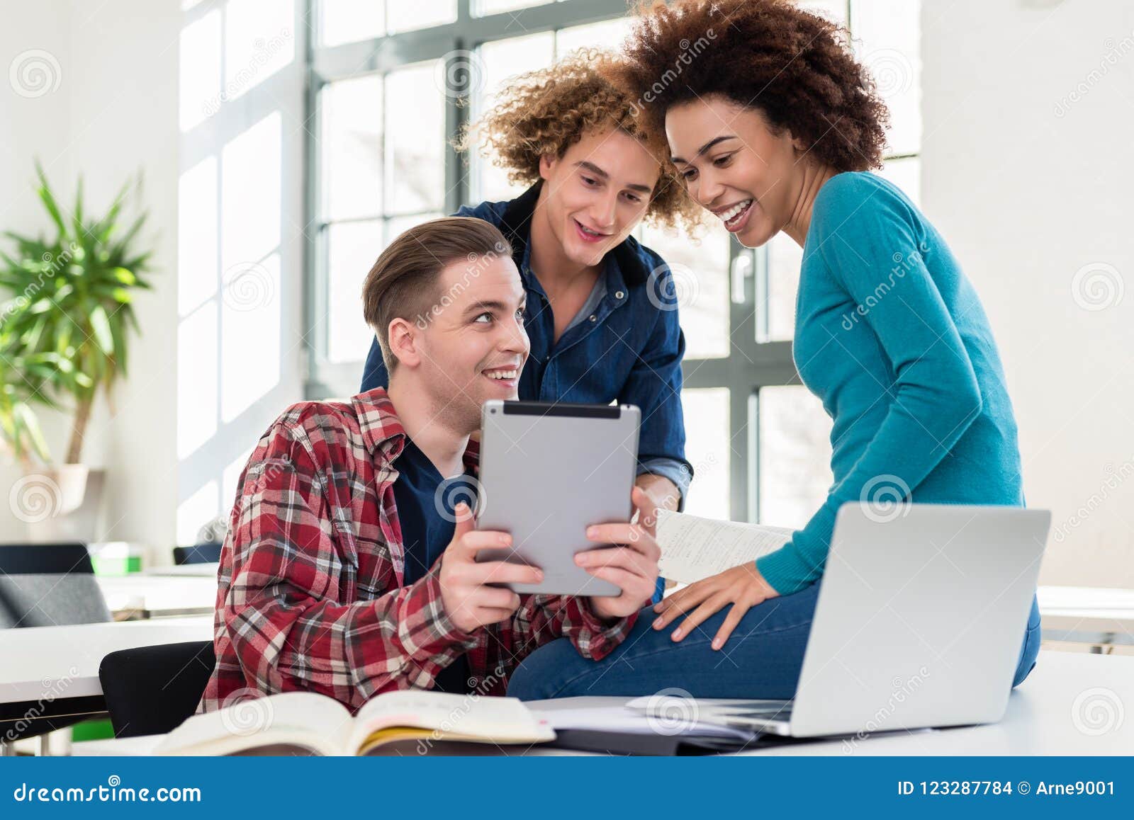Three Involved Students Sharing Ideas and Opinions about Different ...