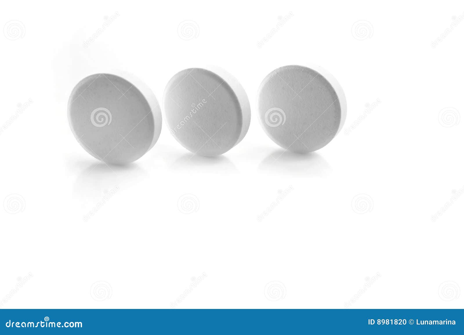 Three Isolated White Round Pills Stock Photo - Image of cure, macro ...
