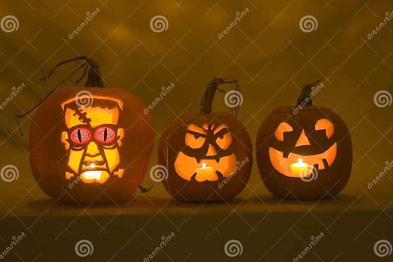 Three jack-o-Lanterns stock photo. Image of round, costumes - 1497752