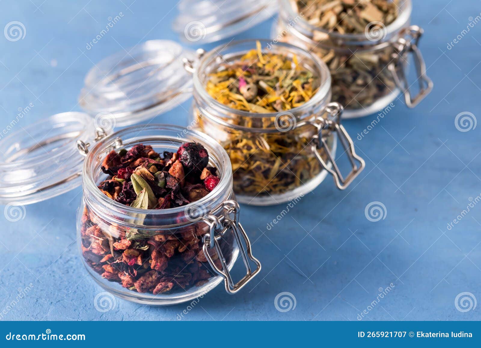 Three Jars of Different Leaf Teas on Blue Background Horizontal Above ...
