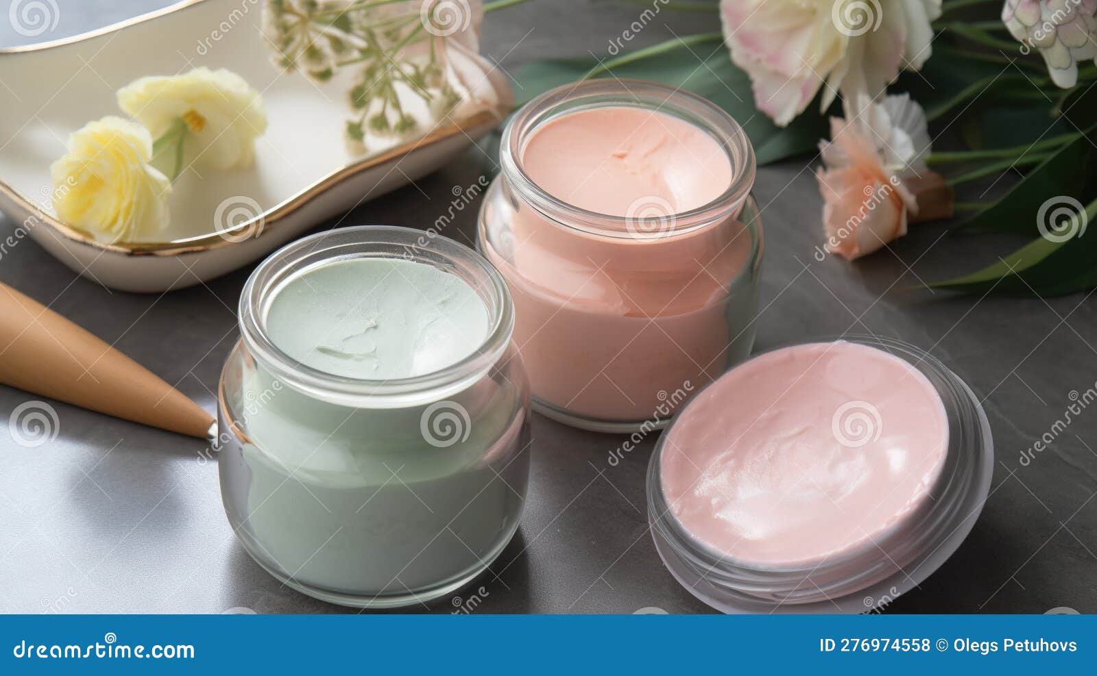 Three Jars of Pink and White Cream Sitting on a Table Stock ...