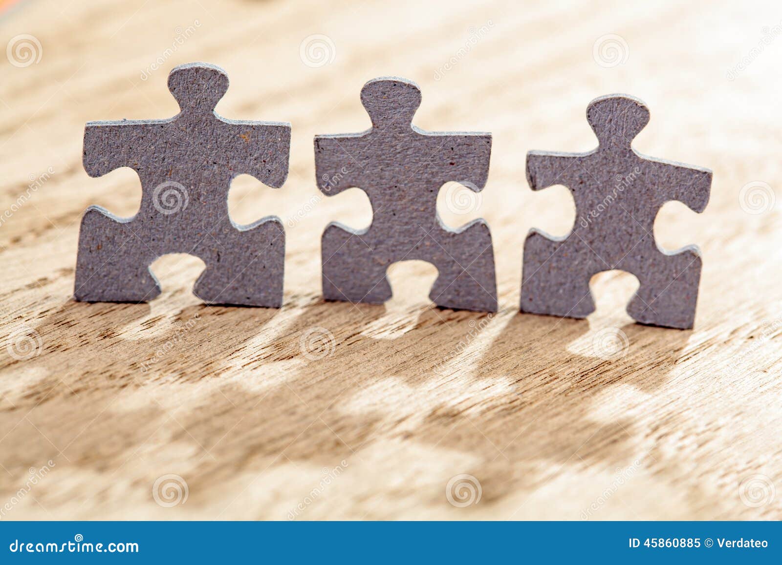 Three Jigsaw Puzzle Pieces on Table Stock Image - Image of three ...