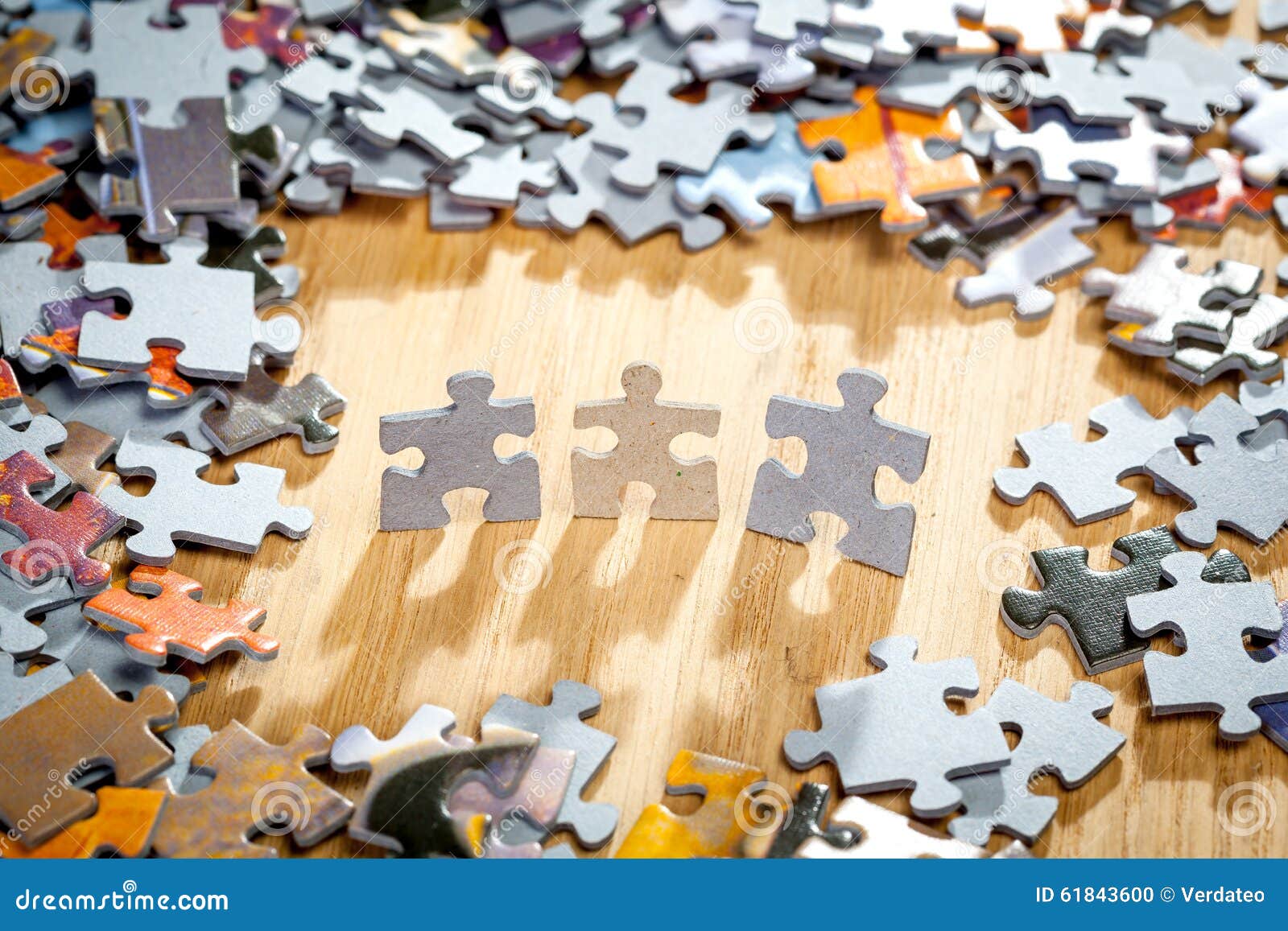 Three Jigsaw Puzzle Pieces on Table Stock Photo - Image of piece ...