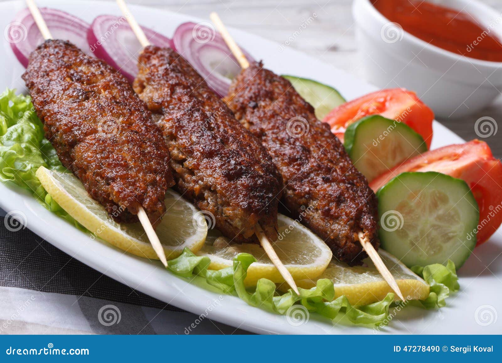 Three Kebab of Minced Meat and Fresh Vegetables Stock Photo - Image of ...
