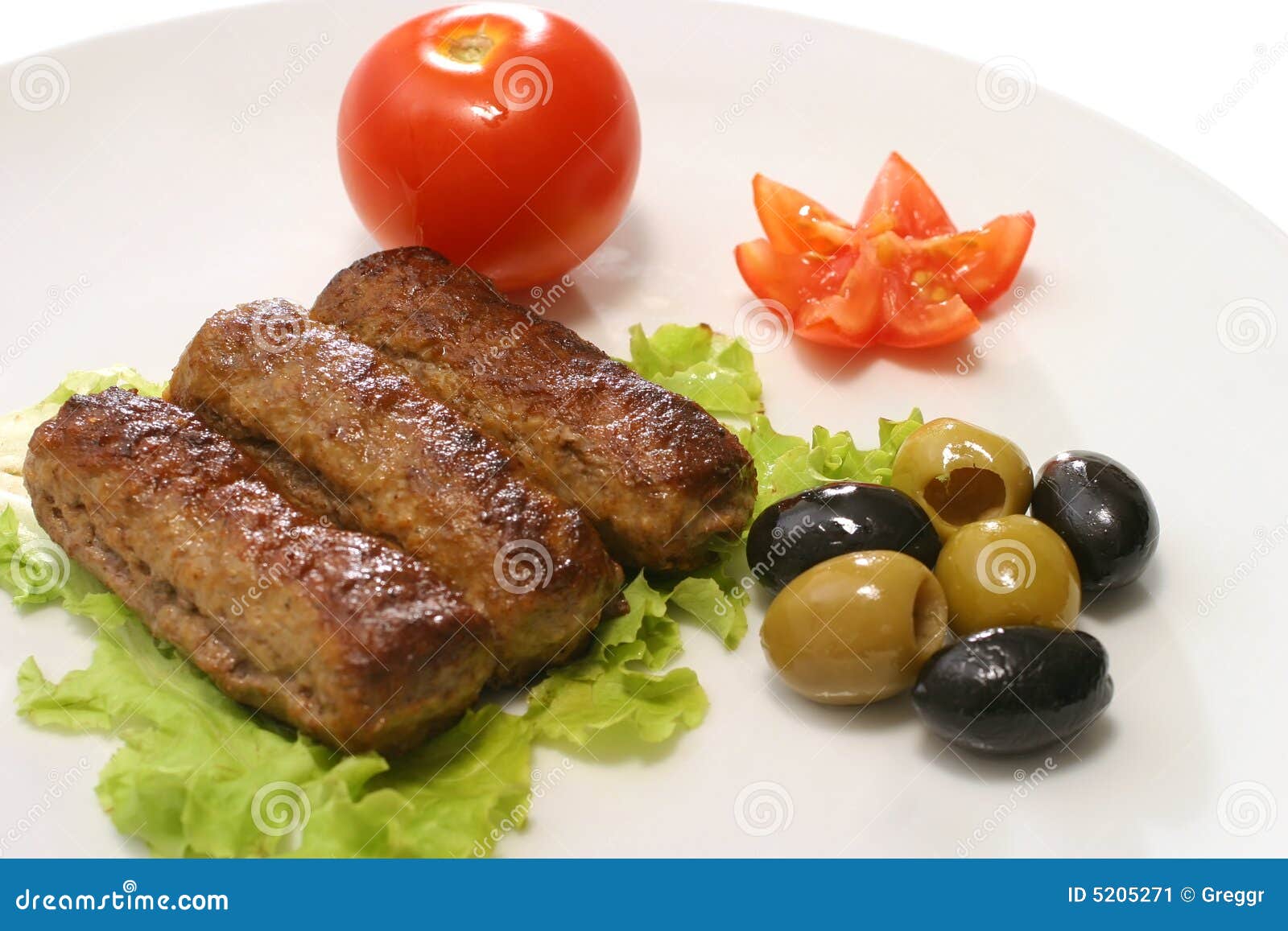 Three kebab rolls on dish stock image. Image of lettuce - 5205271