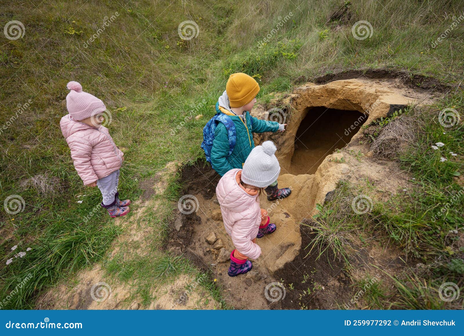 Three Kids Explore Limestone Stone Cave at Mountain Stock Photo - Image ...
