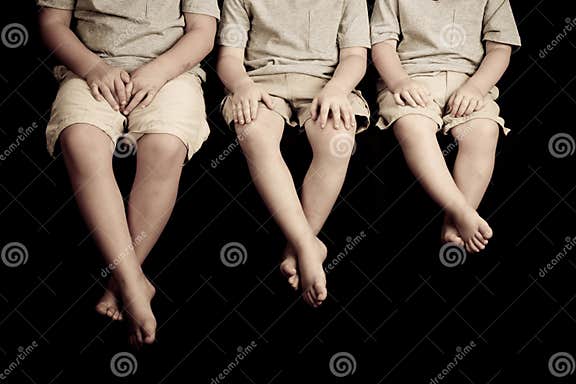 Three Kids hands and Feet stock photo. Image of shorts - 25982792