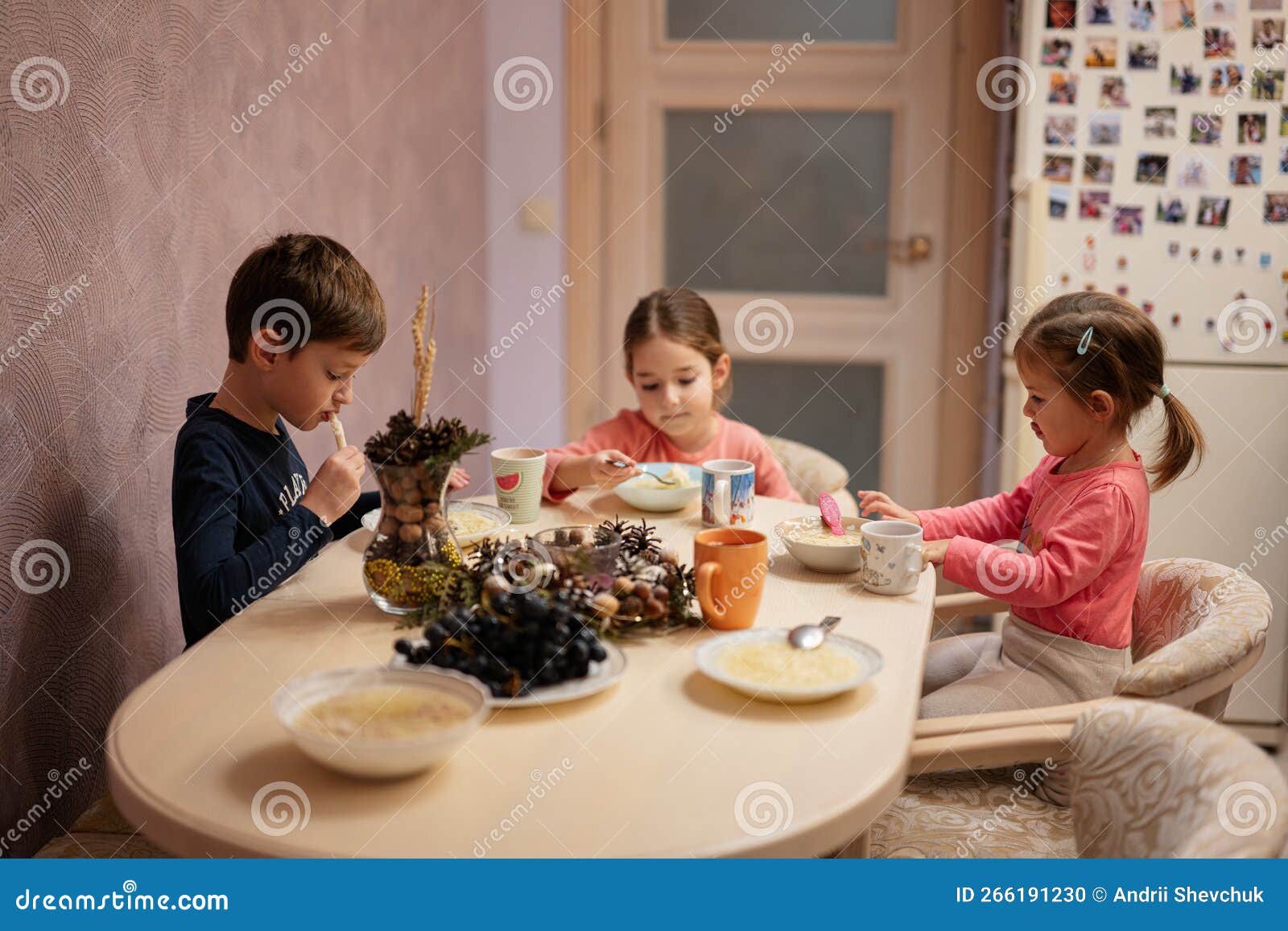 Three Kids Have Dinner Together in the Kitchen Stock Photo - Image of ...