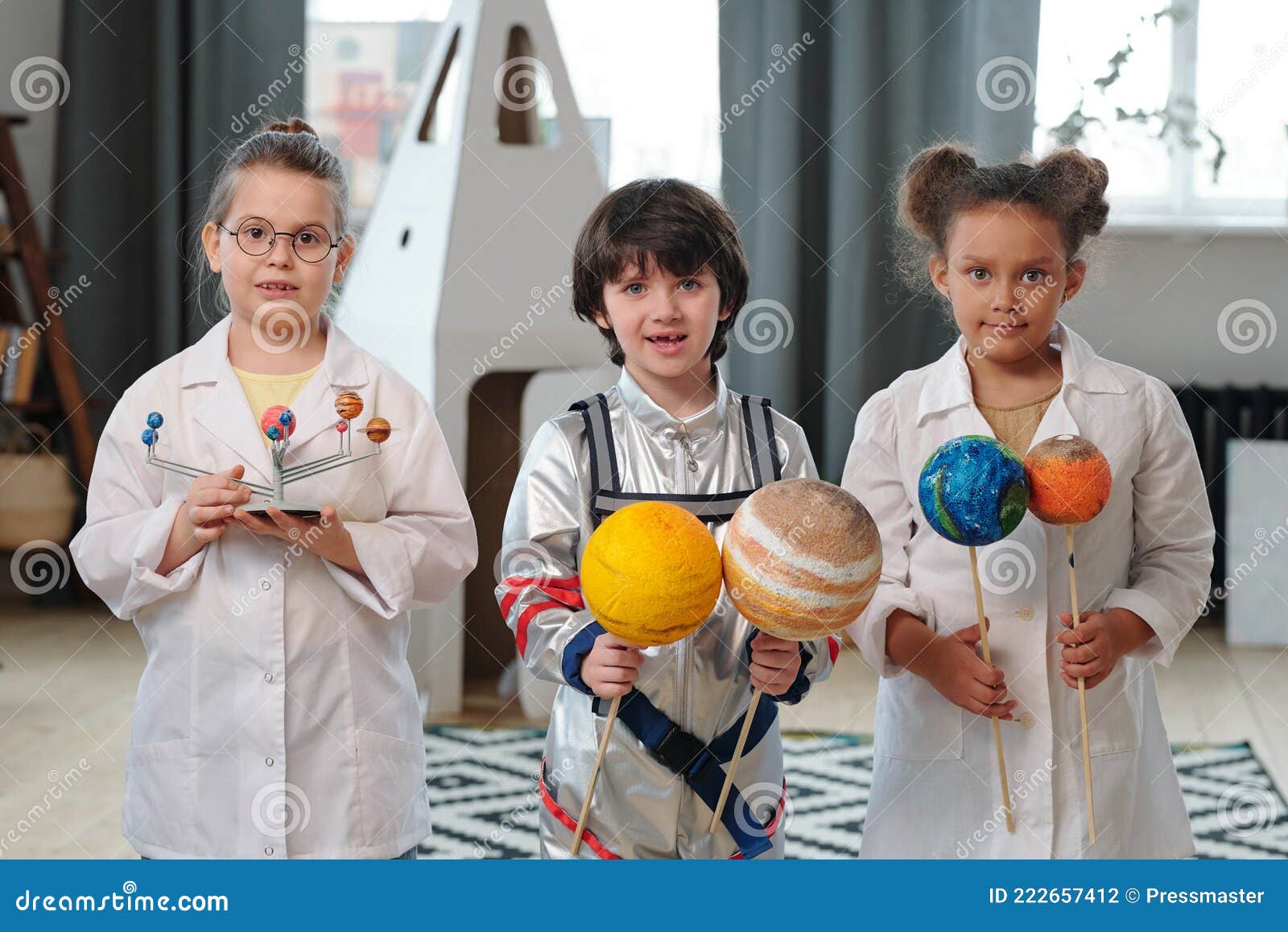 Three Kids Holding Models of Planets of Solar System Stock Photo ...