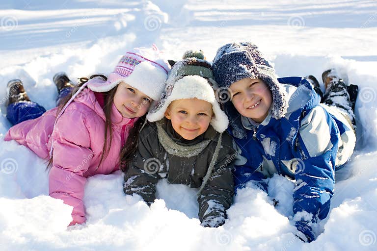 Three Kids Playing in Fresh Snow Stock Image - Image of friends, family ...