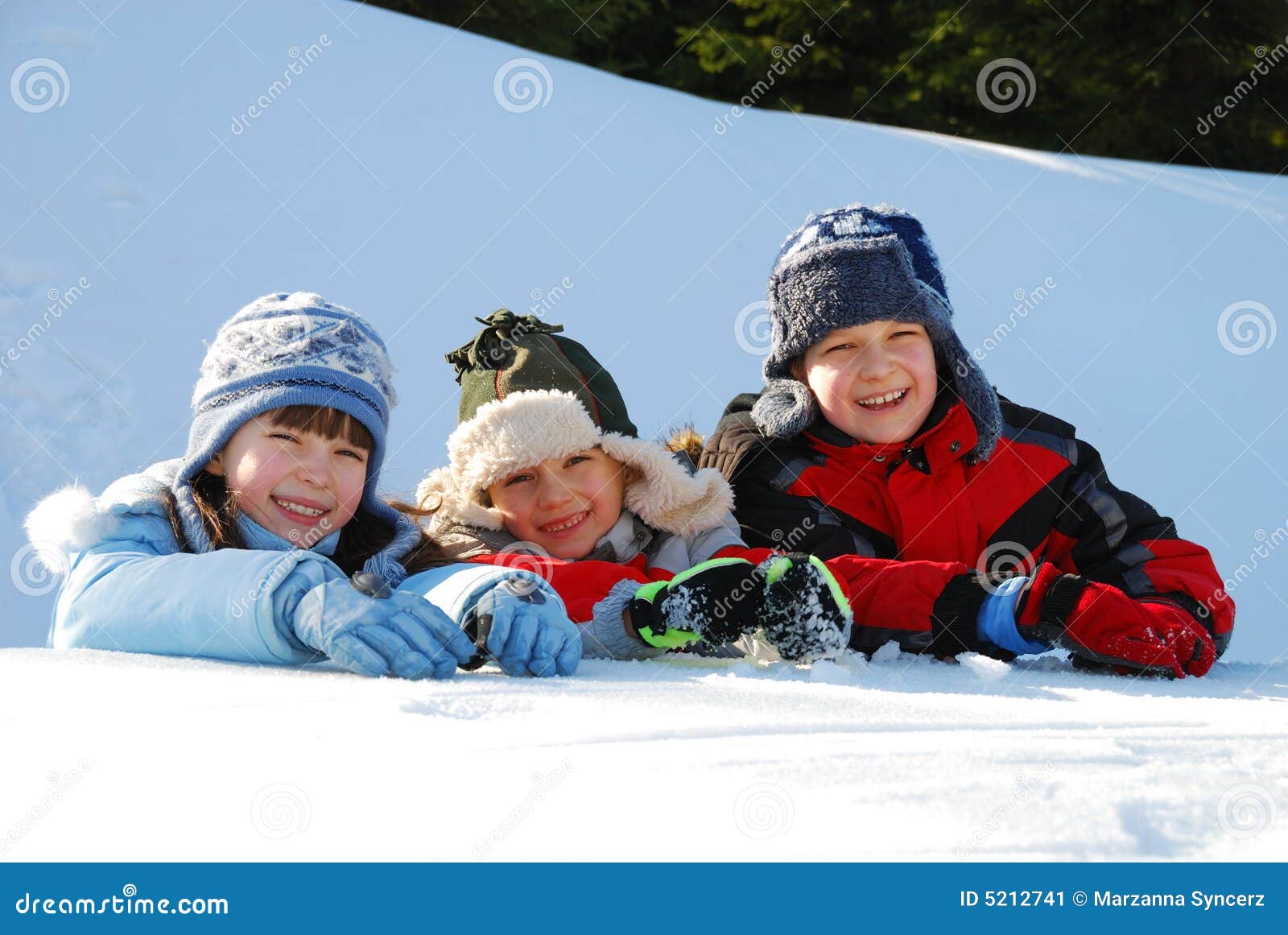 Three Kids Playing in the Snow Stock Image - Image of playing, coats ...